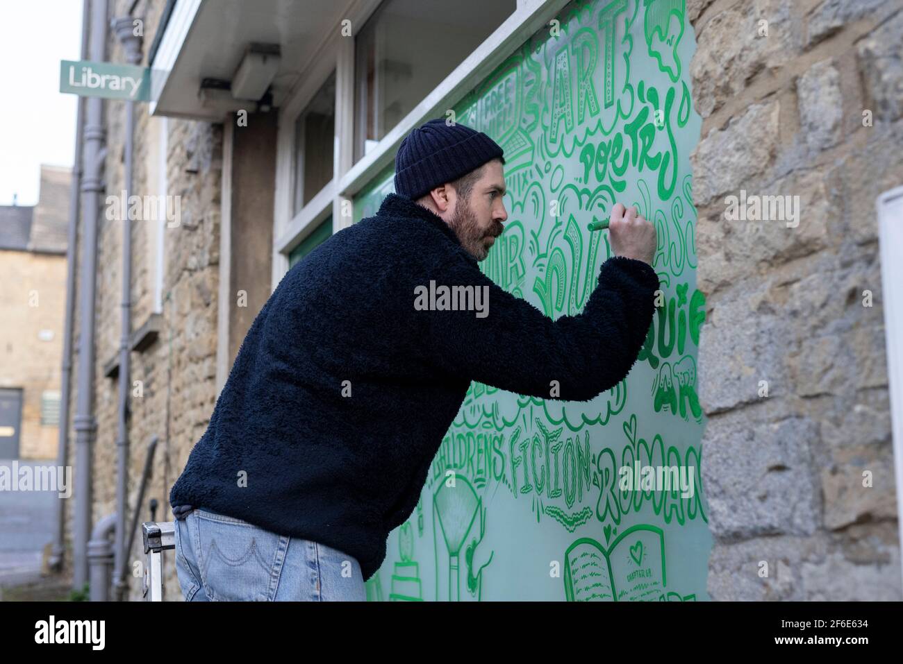 Muralist Luke Embden's Chipping Norton Library window artwork Stock ...