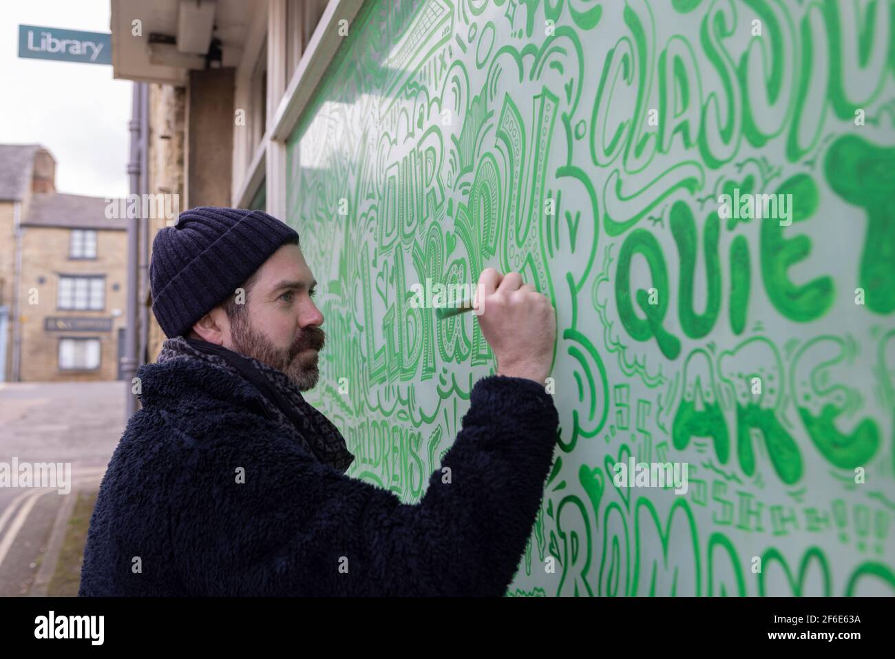 Muralist Luke Embden's Chipping Norton Library window artwork Stock ...