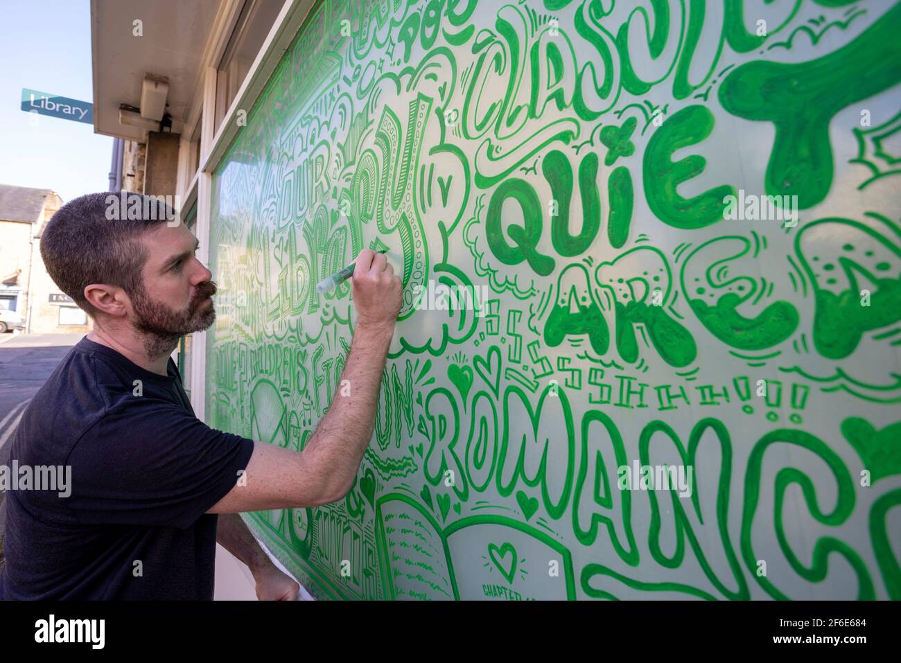 Muralist Luke Embden's Chipping Norton Library window artwork Stock ...