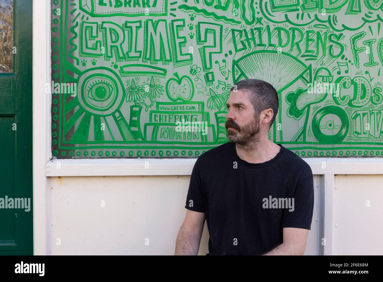 Muralist Luke Embden's Chipping Norton Library window artwork Stock ...