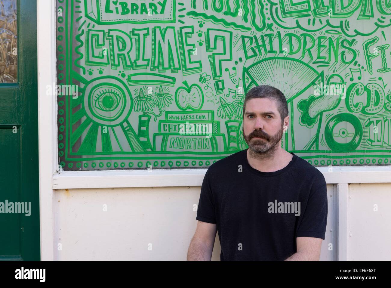 Muralist Luke Embden's Chipping Norton Library window artwork Stock ...