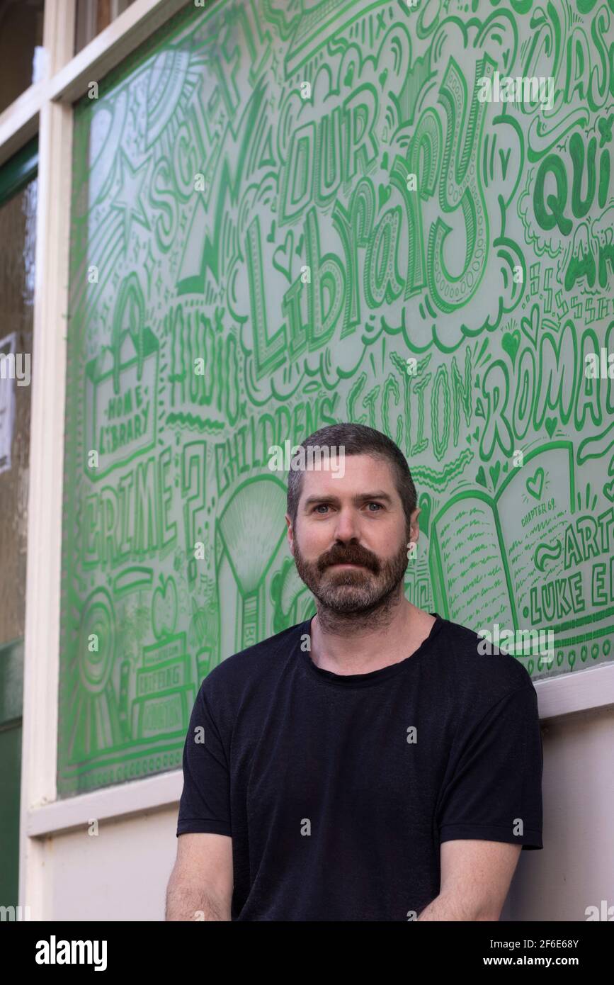 Muralist Luke Embden's Chipping Norton Library window artwork Stock ...