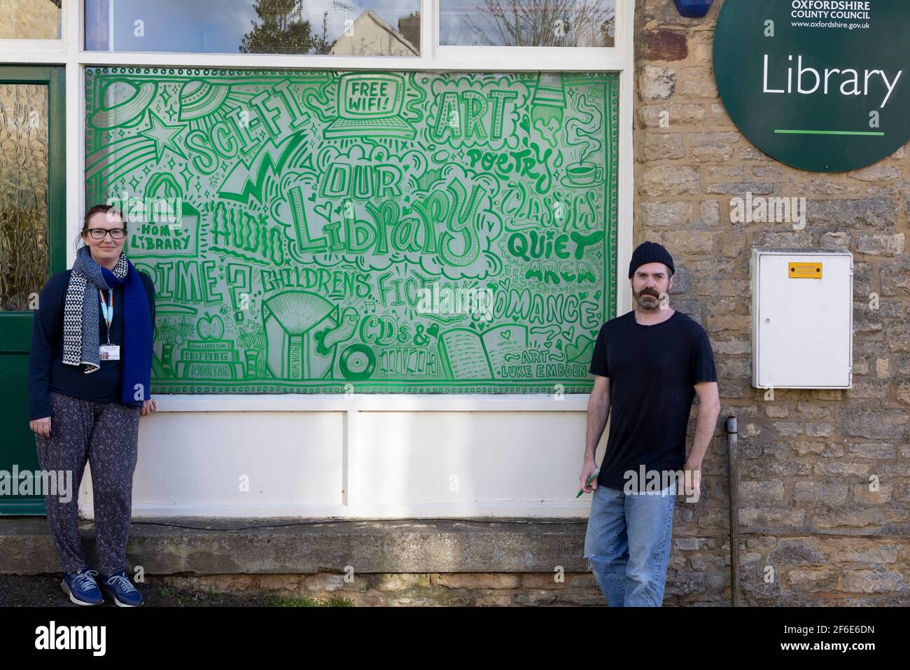 Muralist Luke Embden's Chipping Norton Library window artwork Stock ...