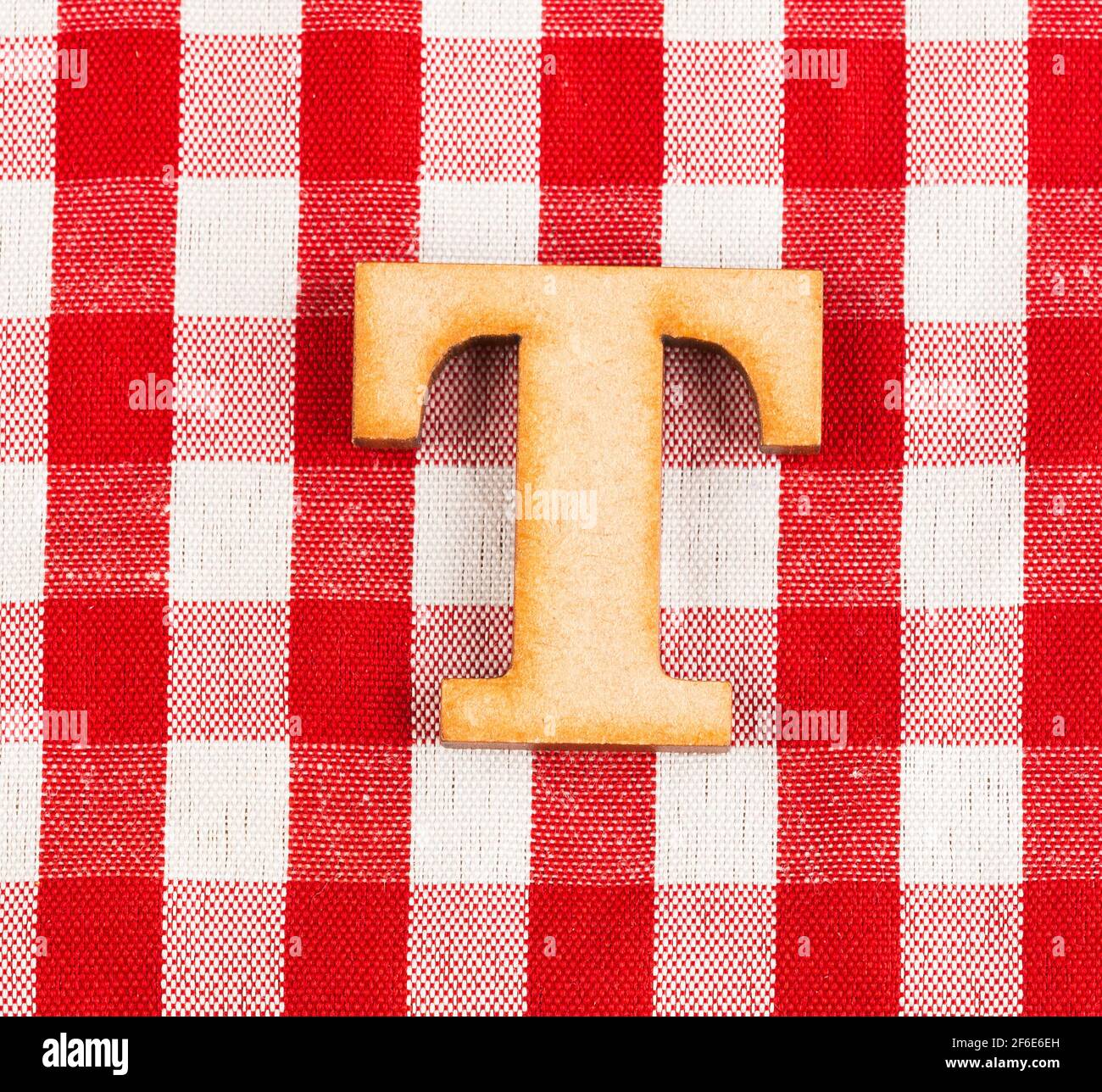 Letter T of the alphabet - Red checkered fabric tablecloth Stock Photo ...