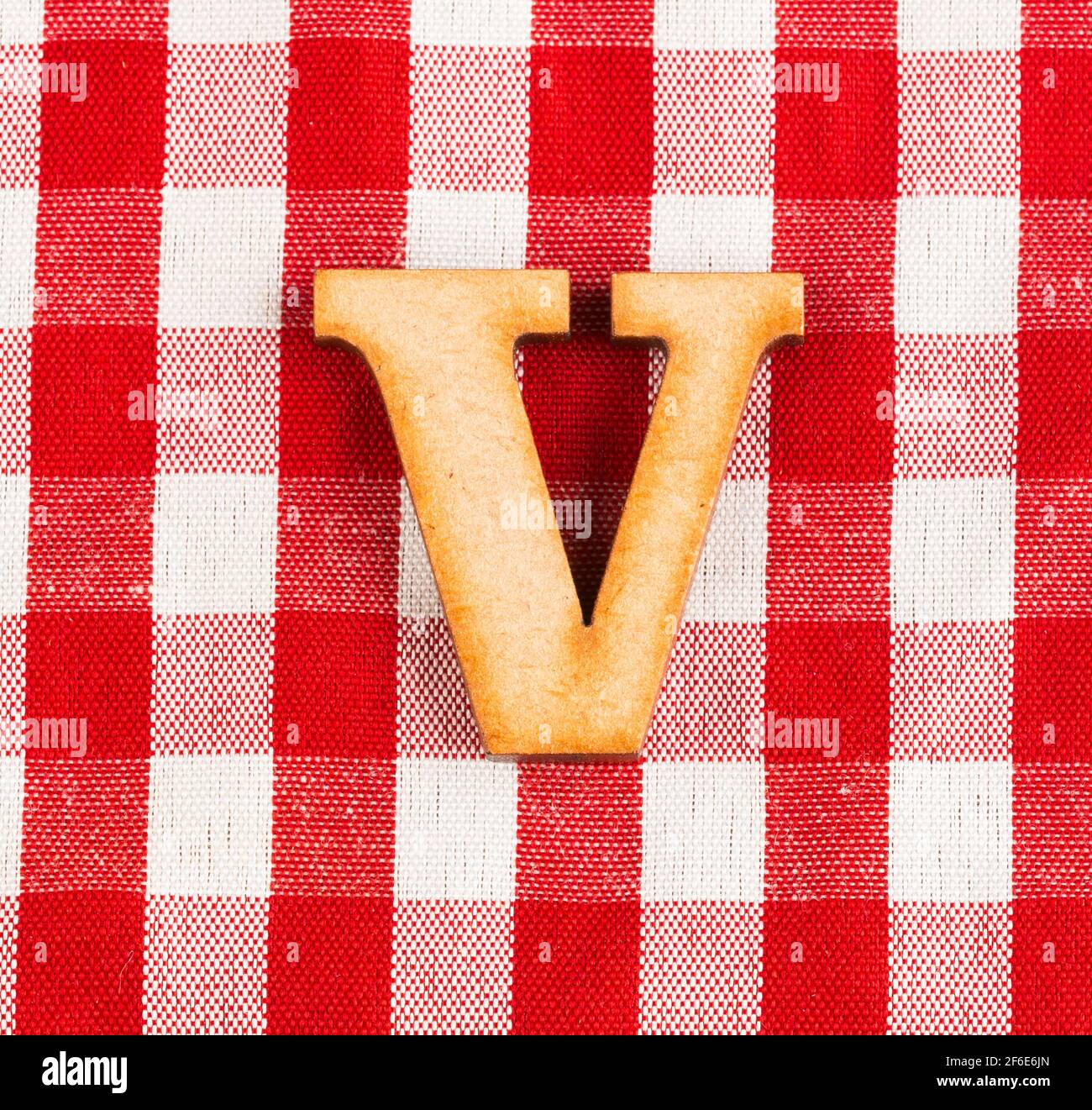 Letter V of the alphabet - Red checkered fabric tablecloth Stock Photo ...