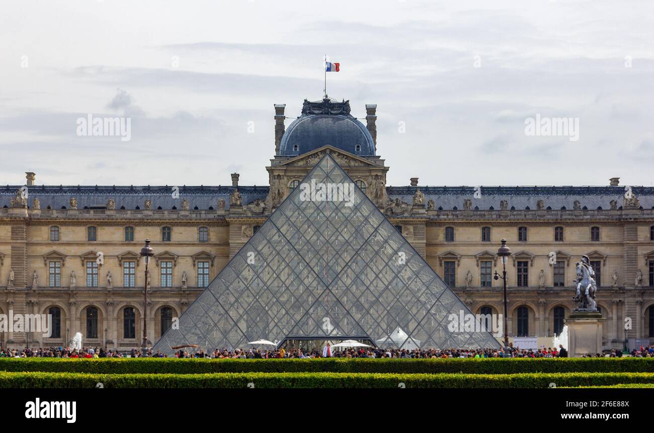 A picture of the iconic Louvre Pyramid as seen from afar Stock Photo ...