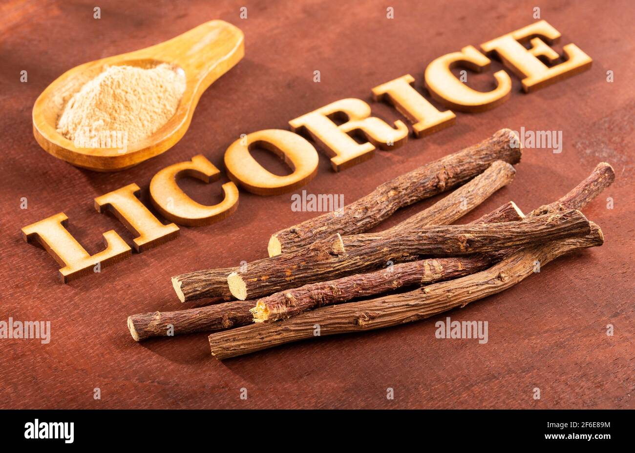 Licorice powder and roots - Glycyrrhiza glabra Stock Photo - Alamy