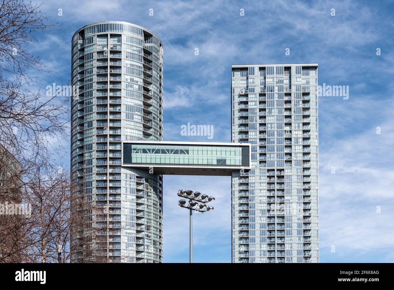 Pedestrian bridge between two modern architecture buildings in the ...