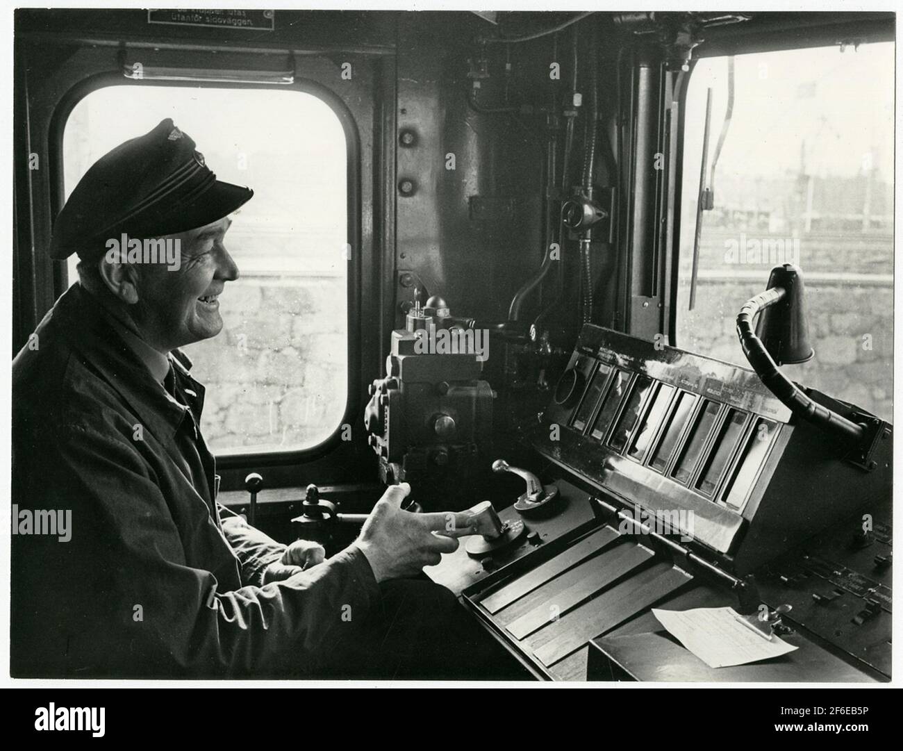 Train driver in cab Stock Photo - Alamy