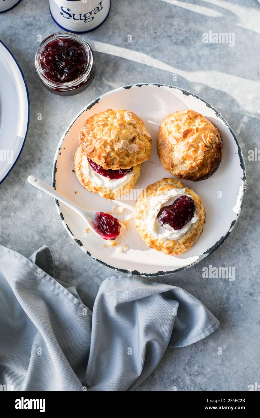 Traditional British Scones with clotted cream, raspberry jam Stock ...
