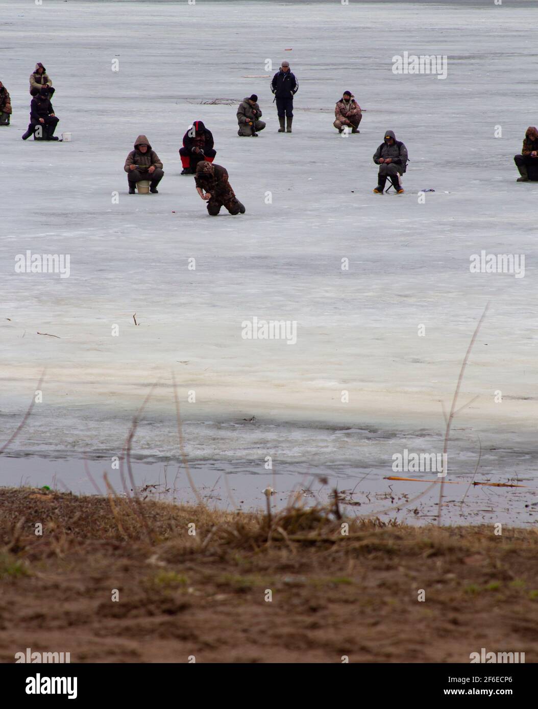 Ice fishermen fishing in frozen hi-res stock photography and images - Alamy