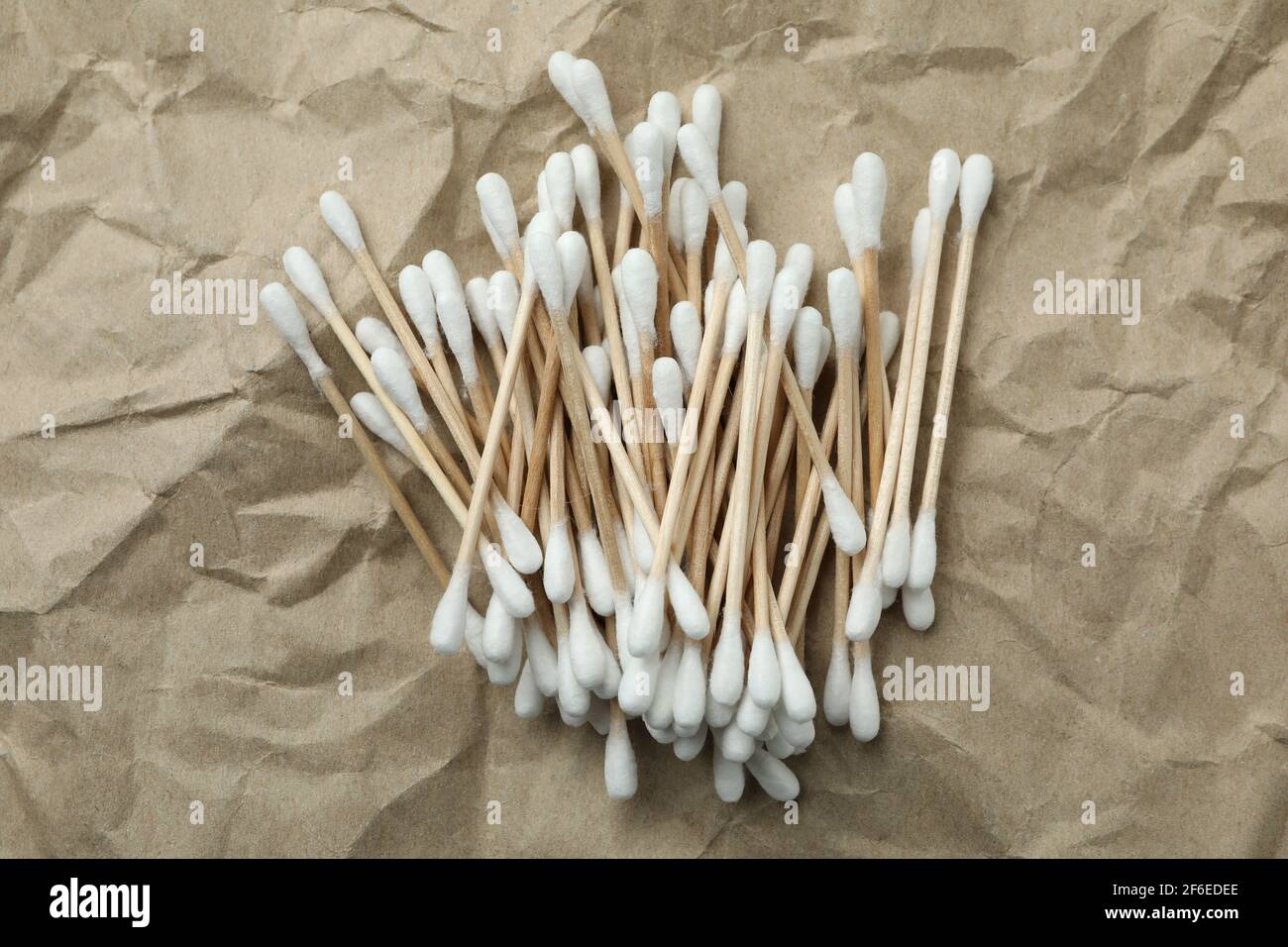 Heap of cotton swabs on craft paper background Stock Photo - Alamy