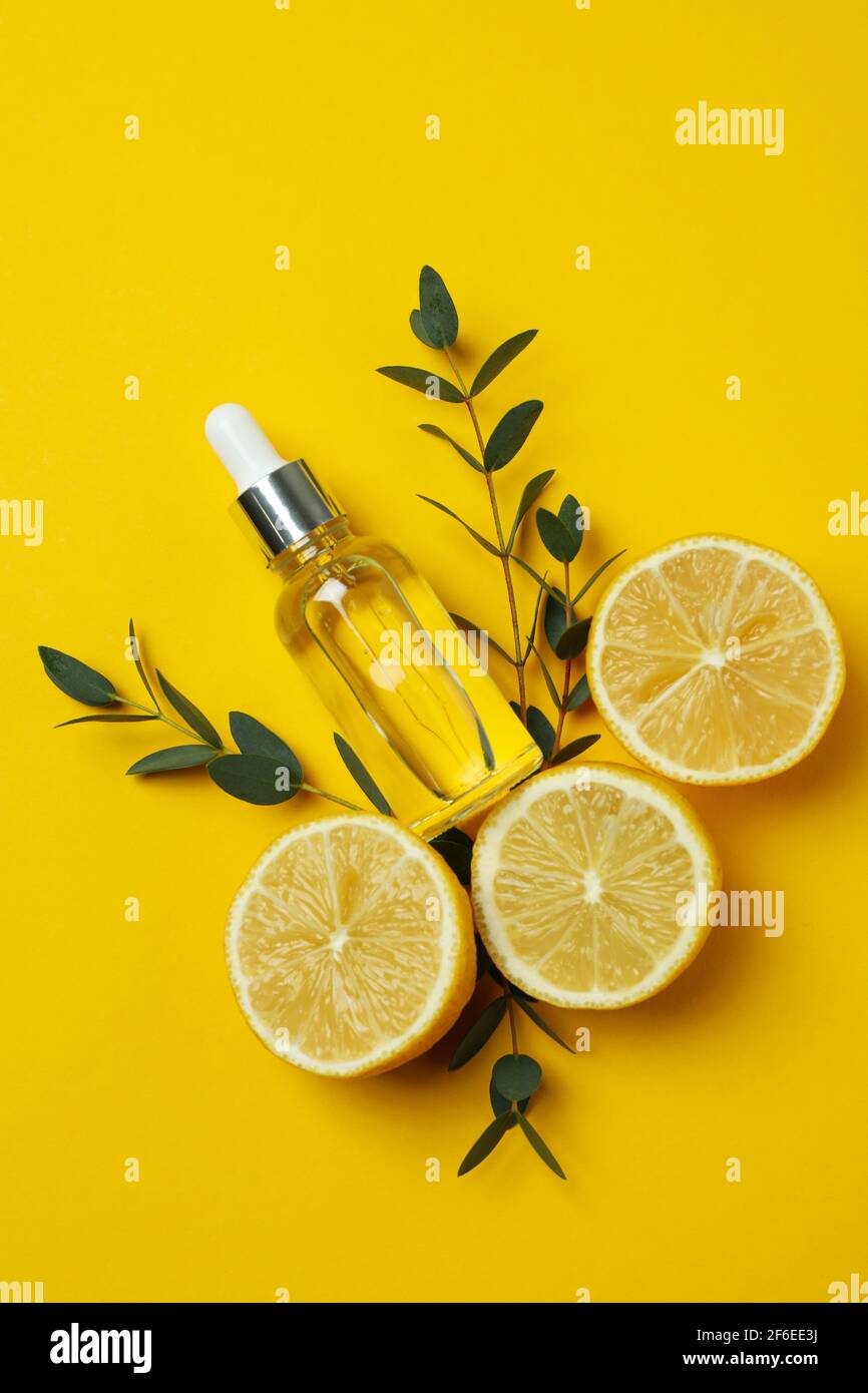 Concept of natural cosmetics with lemon oil on yellow background Stock ...