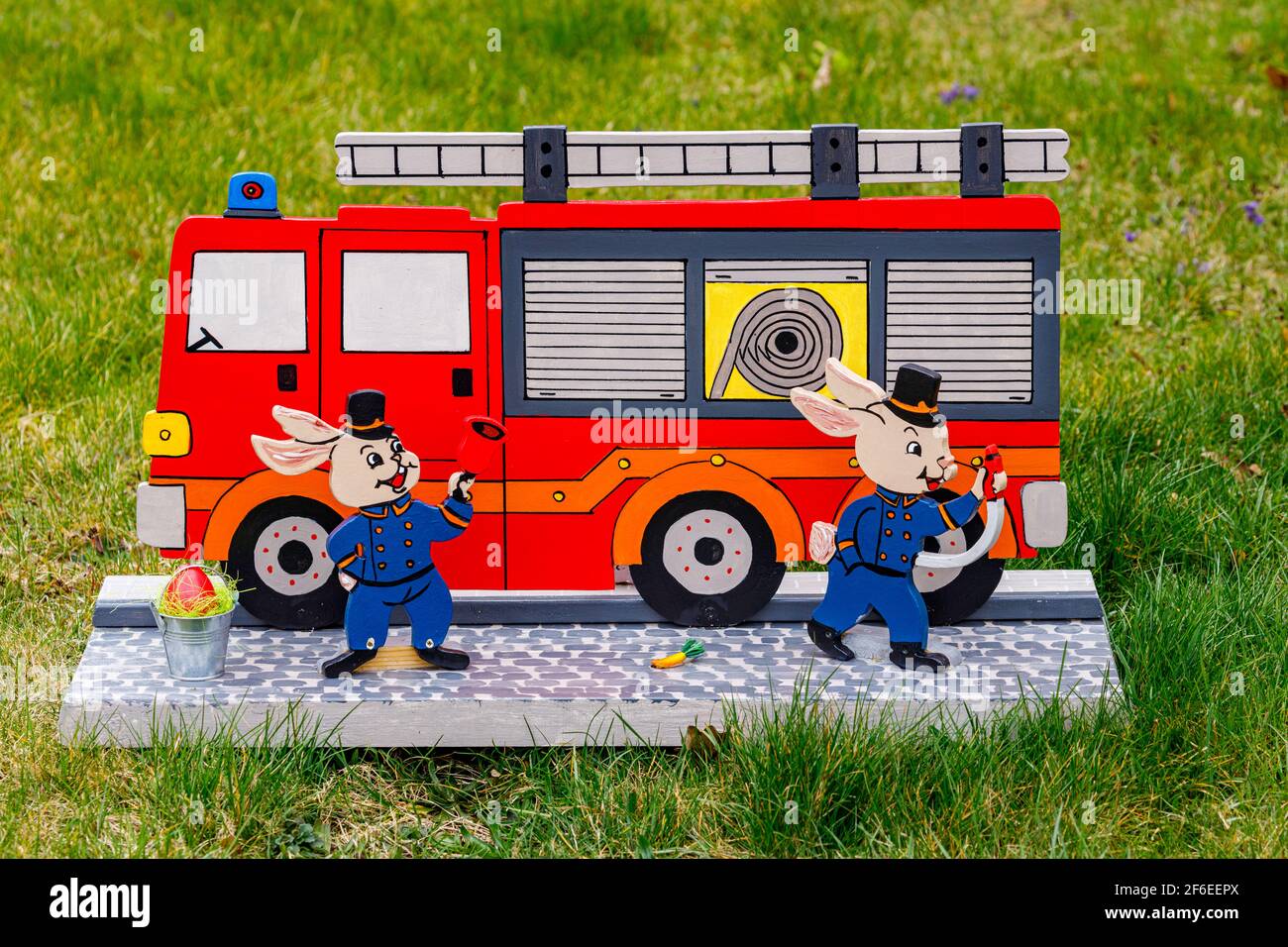 Easter Bunny with a fire engine at the Easter Bunny Trail of ...