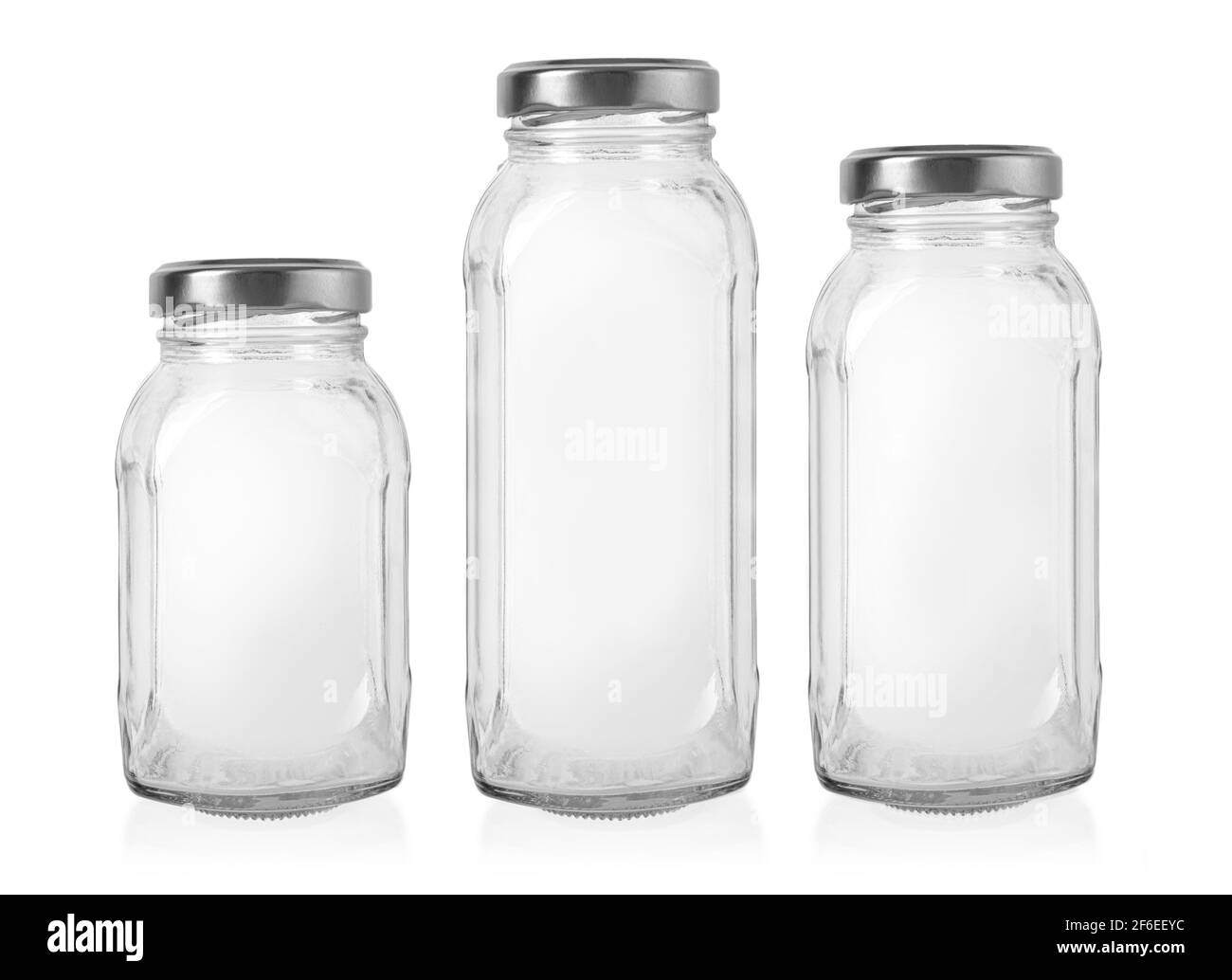 four glass jars isolated on white background Stock Photo - Alamy