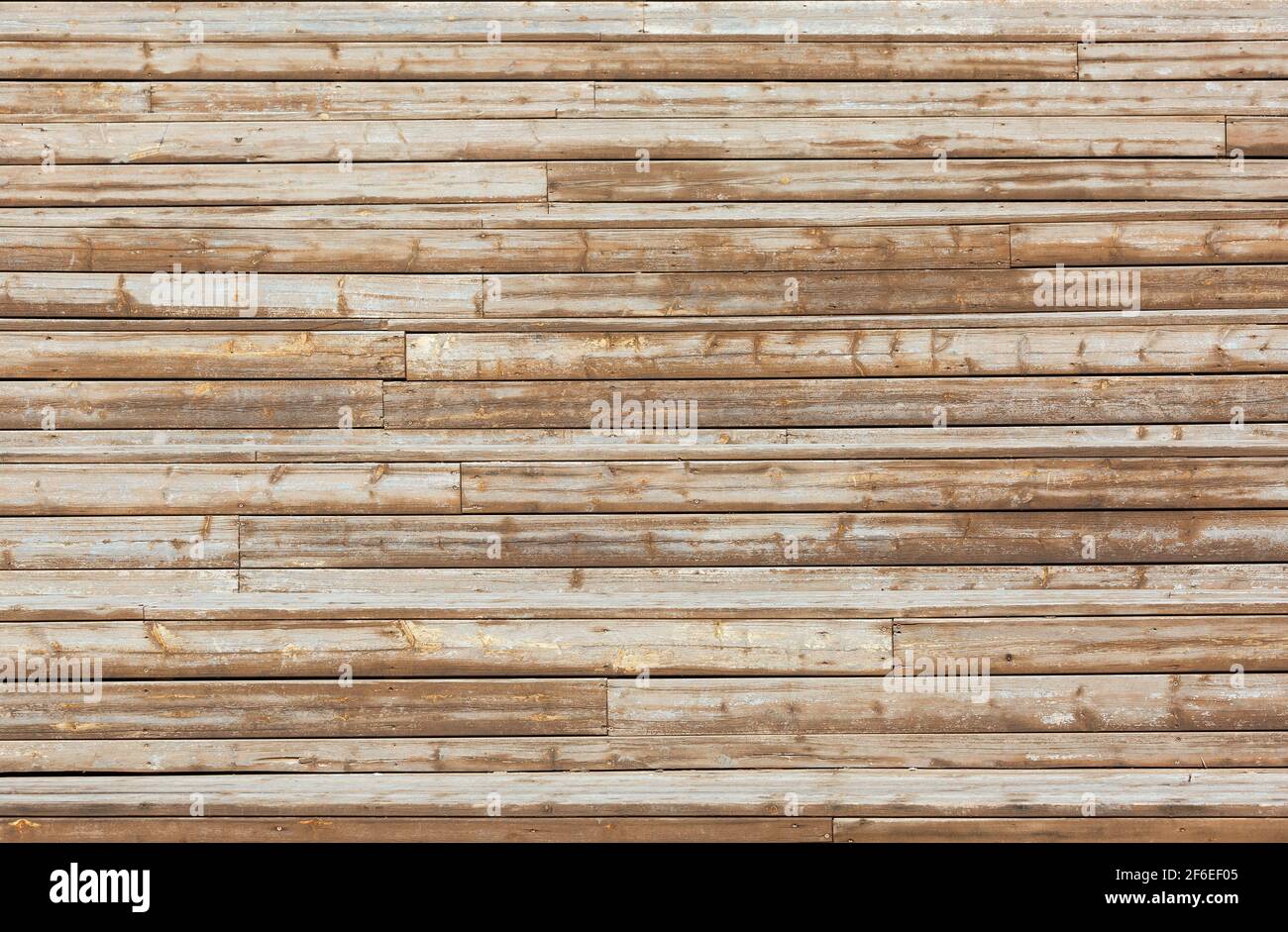Wall folded from wooden logs background Stock Photo - Alamy