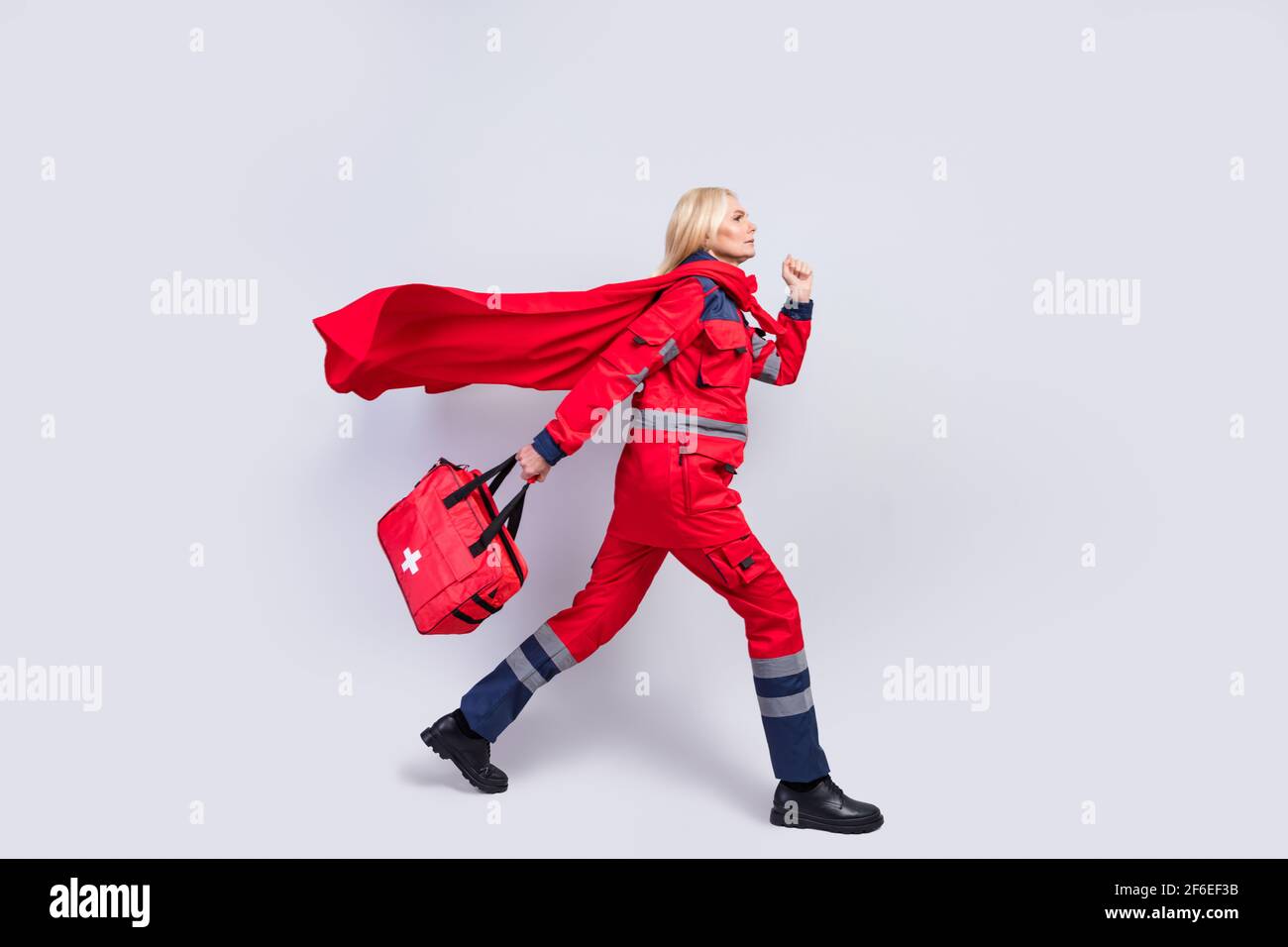 Full size profile side photo of brave serious paramedic old woman walk ...