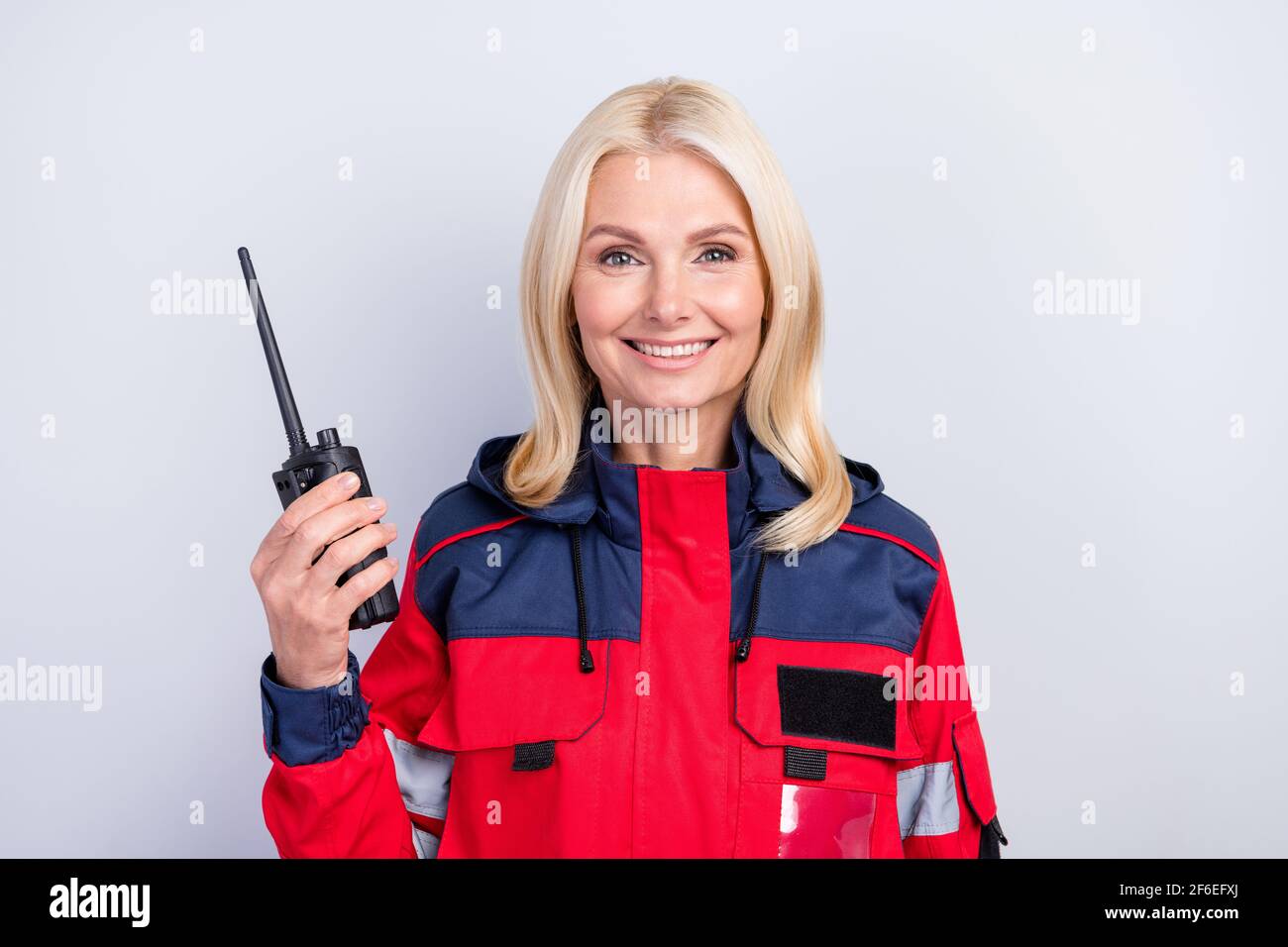 Photo of cheerful happy nice old lady hold radio work paramedic ...
