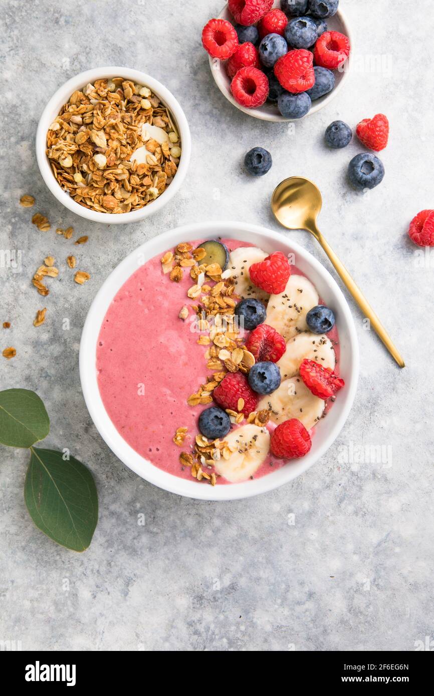 Summer acai smoothie bowls with raspberries, banana, blueberries, and ...
