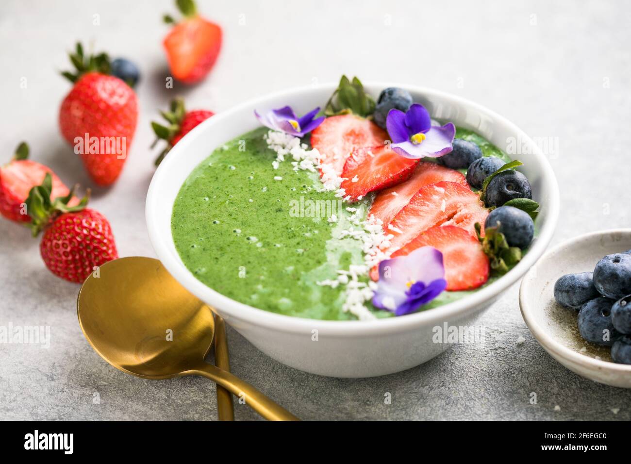 Colorful, healthy food. Acai green smoothie bowl. Keto breakfast idea ...