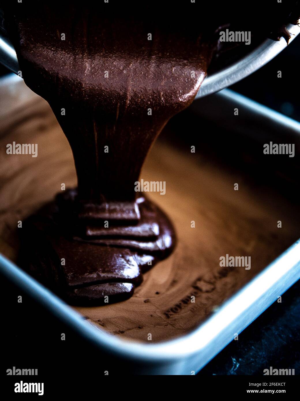 Pouring brownie batter into pan Stock Photo - Alamy