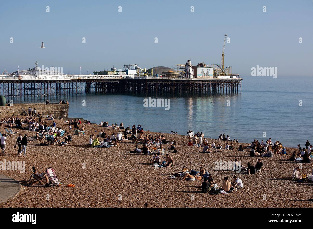 Brighton, UK. 30th March 2021. Brighton Beach Spring Weather Sunbathers ...
