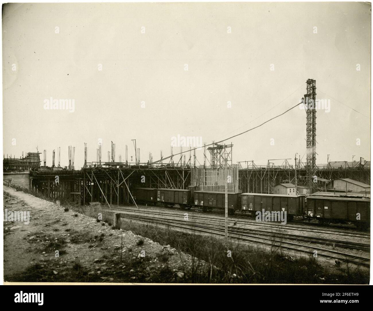 Distribution tower with conveyor. Ongoing bridge building. Bridge over ...