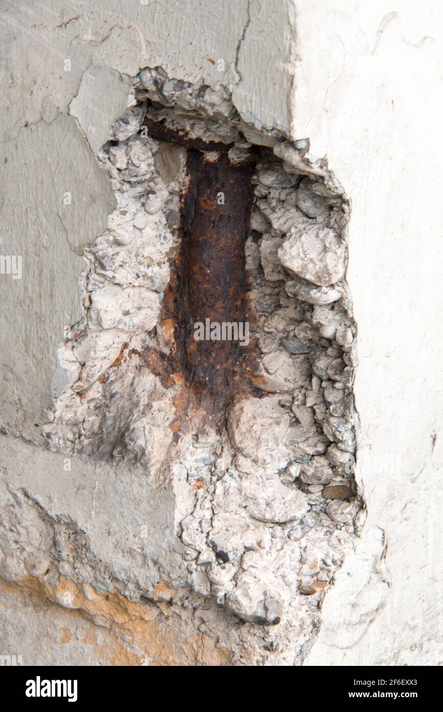 Concrete corner with rust, burst Stock Photo - Alamy