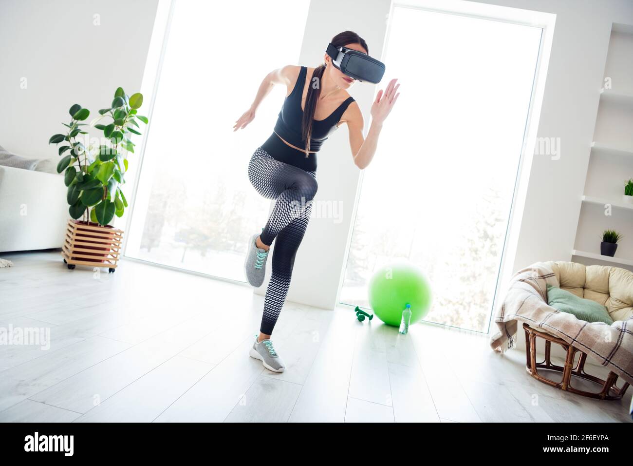 Full size photo of young serious beautiful athlete woman running fast ...