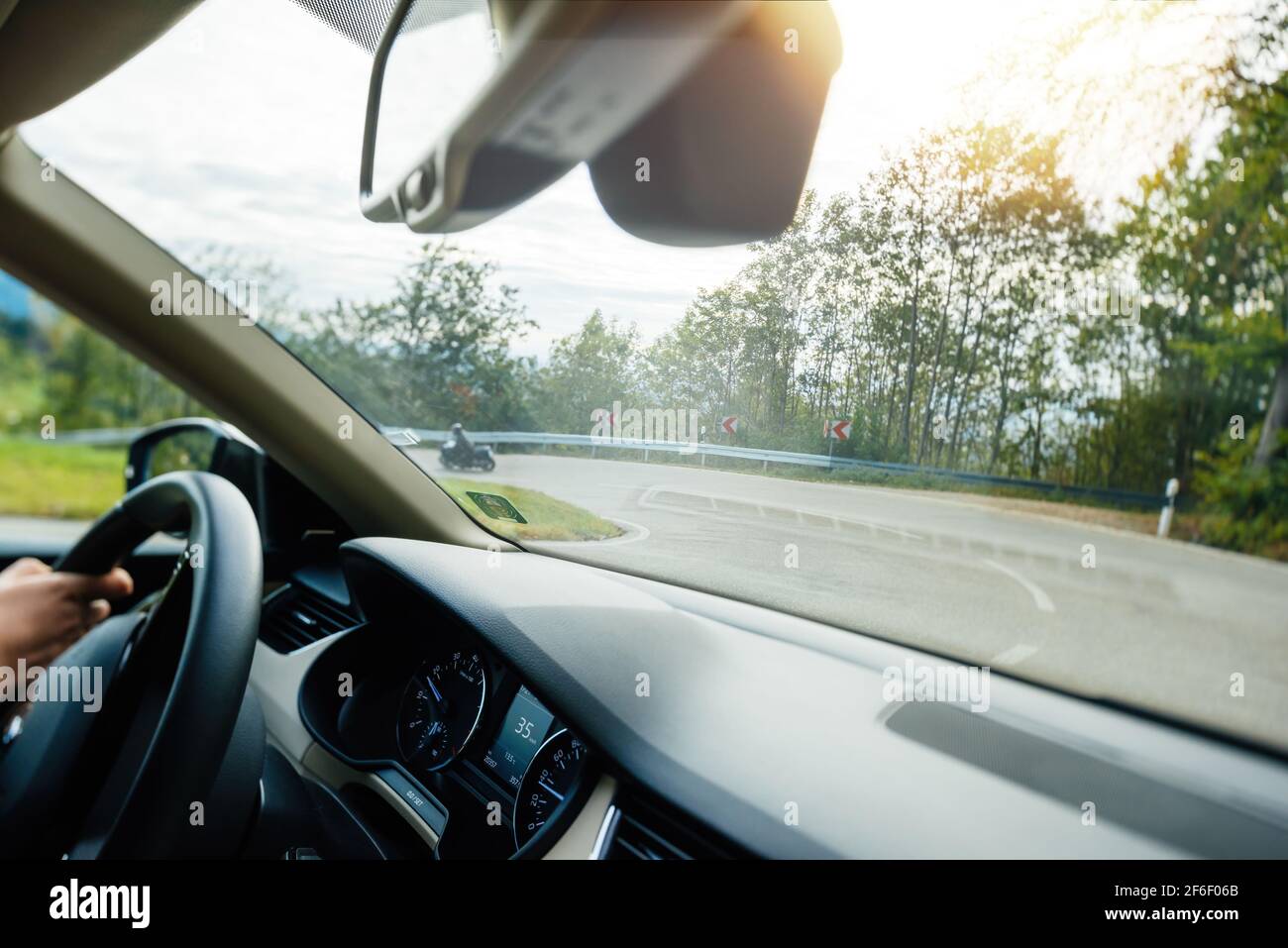 Entering difficult corner on the rural highway with 35 km mph per hour ...