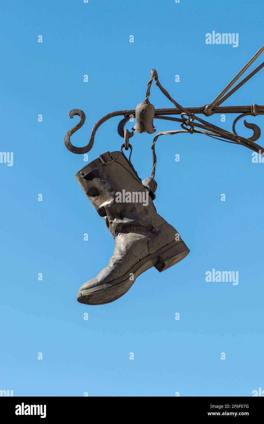 old shoe made of metal; advertising sign Stock Photo - Alamy