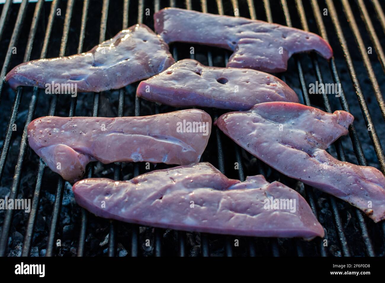 preparing veal liver on the grill Stock Photo - Alamy