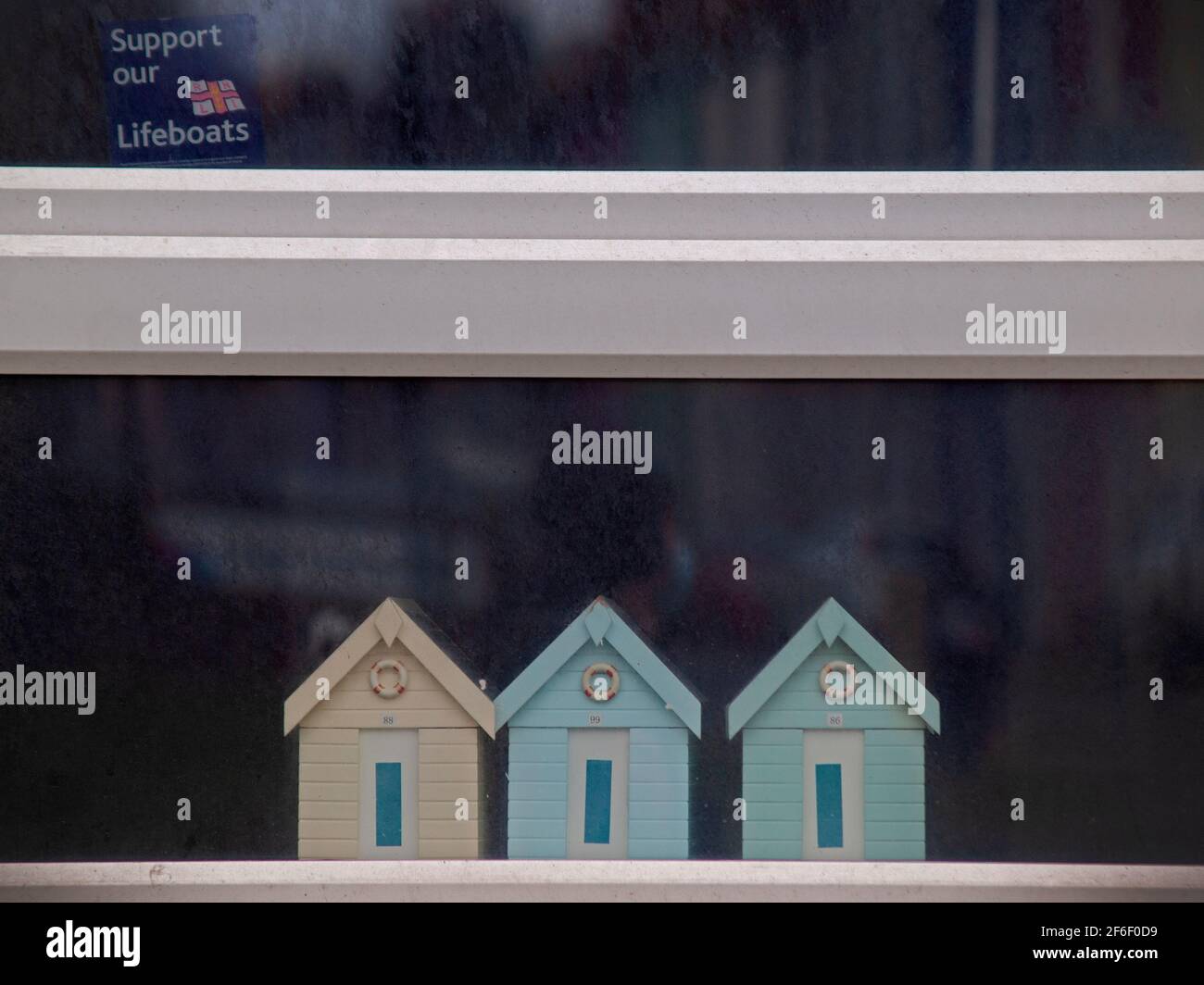 Miniature beach huts in the window of a Brighton home Stock Photo - Alamy