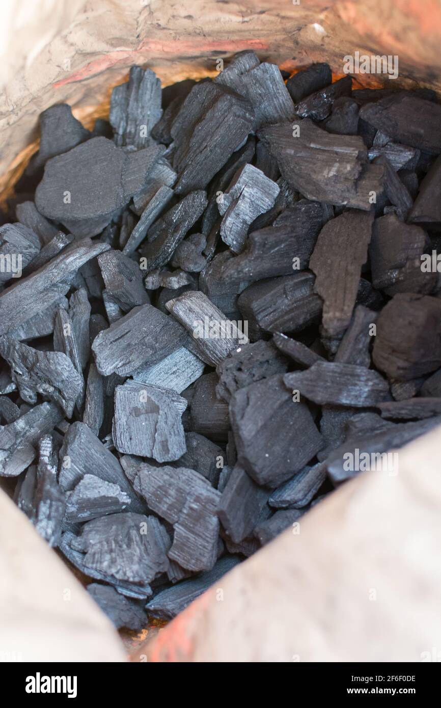 close-up photo of coal in the paper bag Stock Photo - Alamy