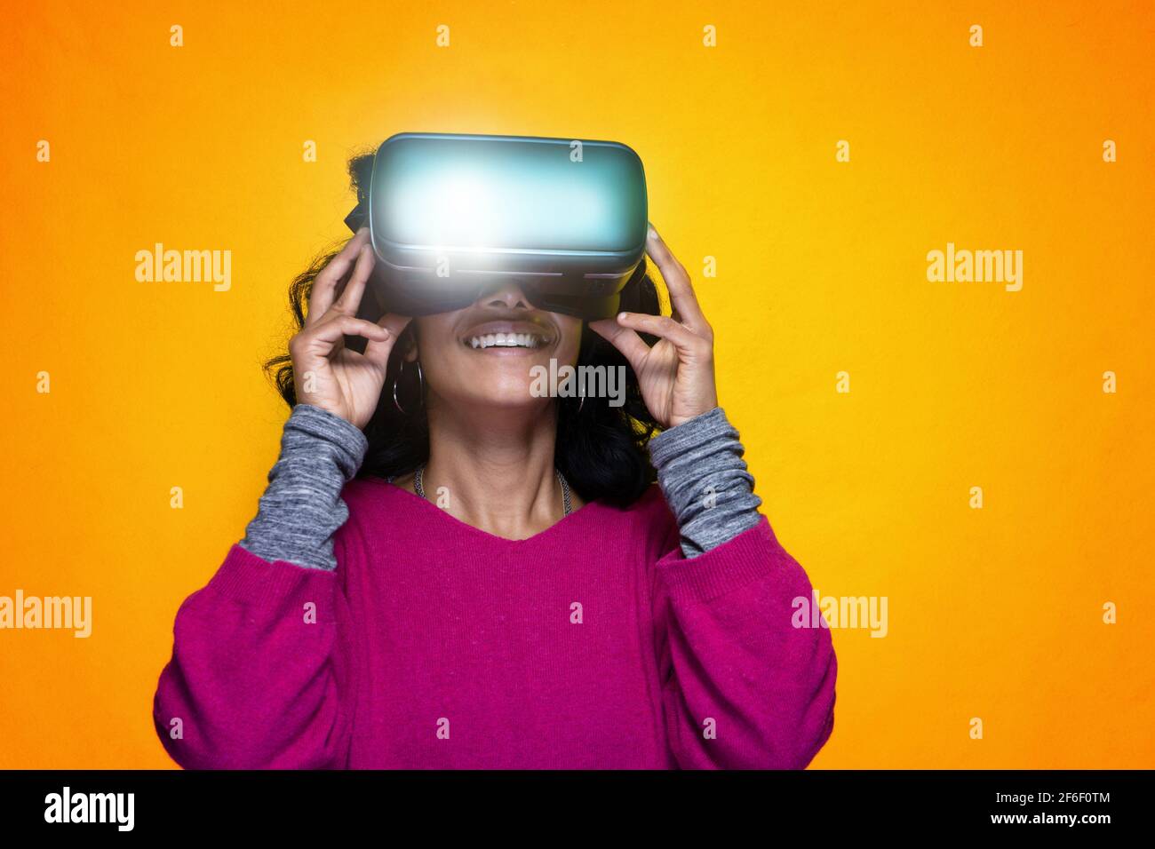 Beautiful young indian woman uses Vr glassess for augmented reality ...