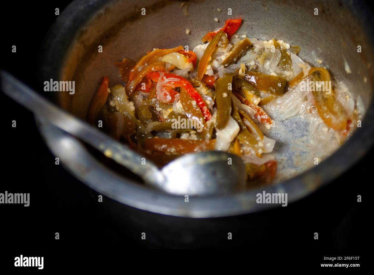 A pot filled with Ema Datshi (Chili Pepper and Cheese), the most famous ...