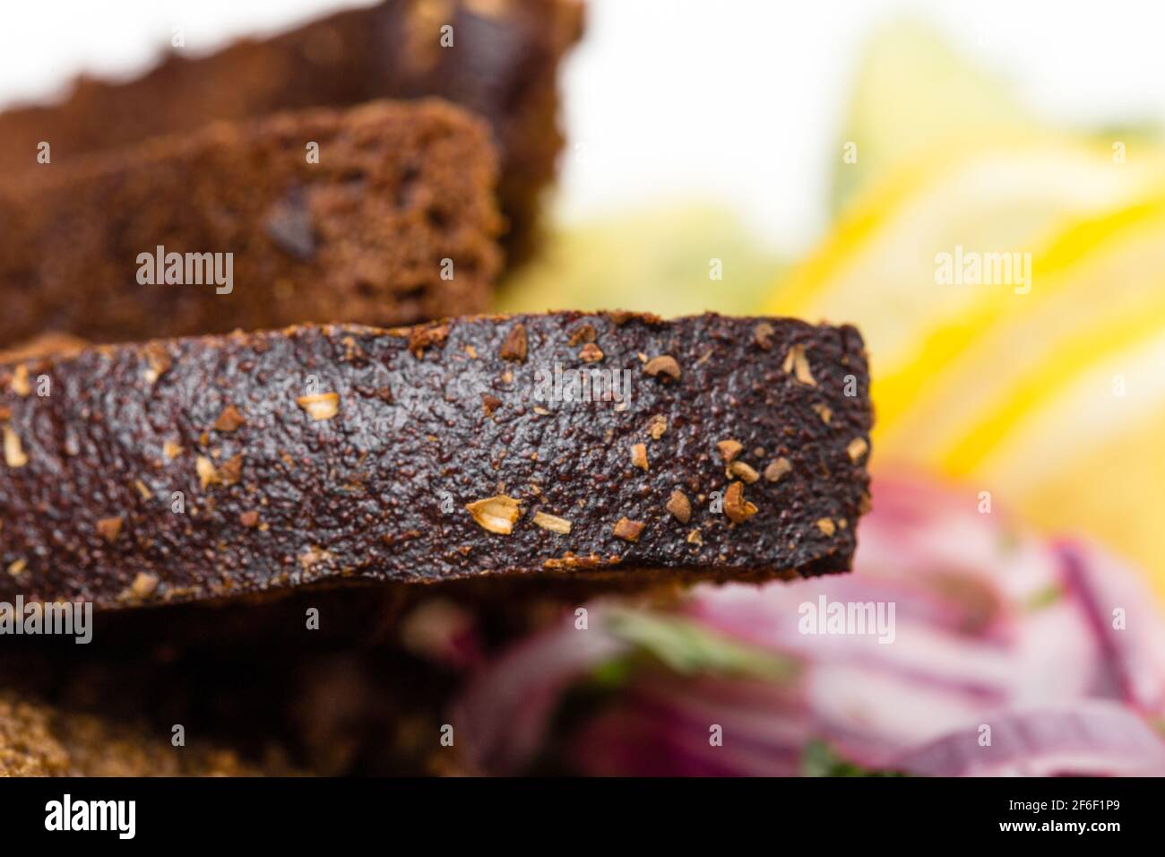 Grilled rye bread and marinated red onion. Macro. Photo can be used as ...