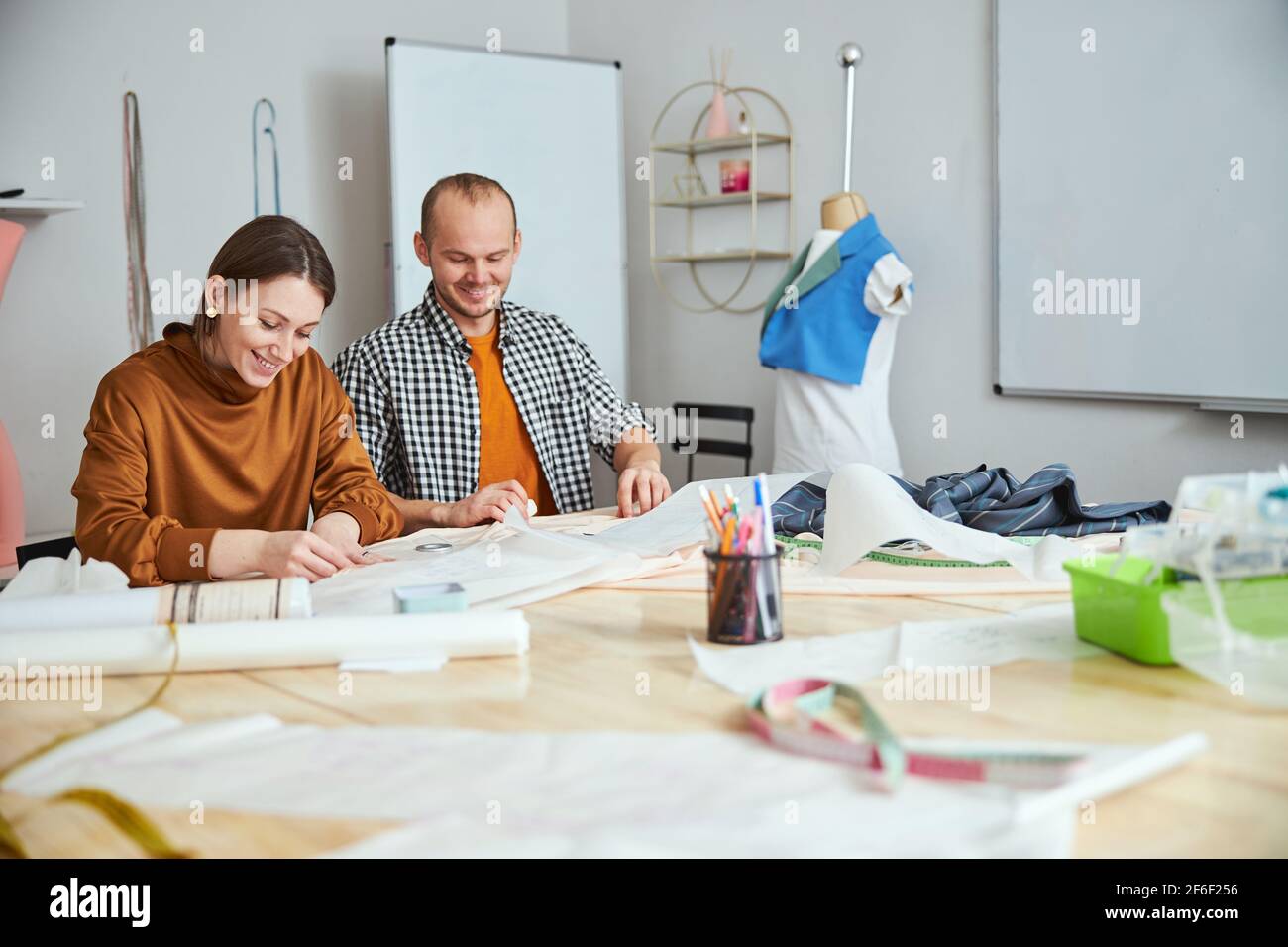 Regular working day of two friendly fashion designers Stock Photo - Alamy