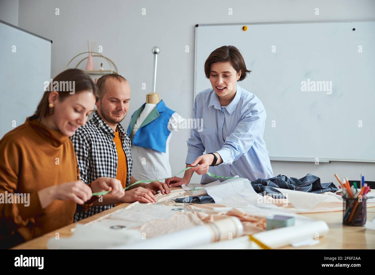Talented enthusiastic team working at the new project Stock Photo - Alamy