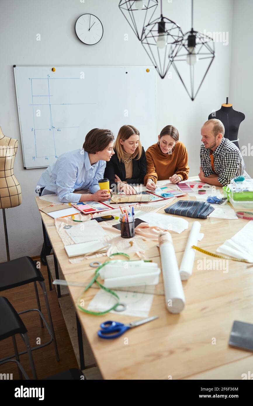 Interesting working process in the modern fashion studio Stock Photo ...