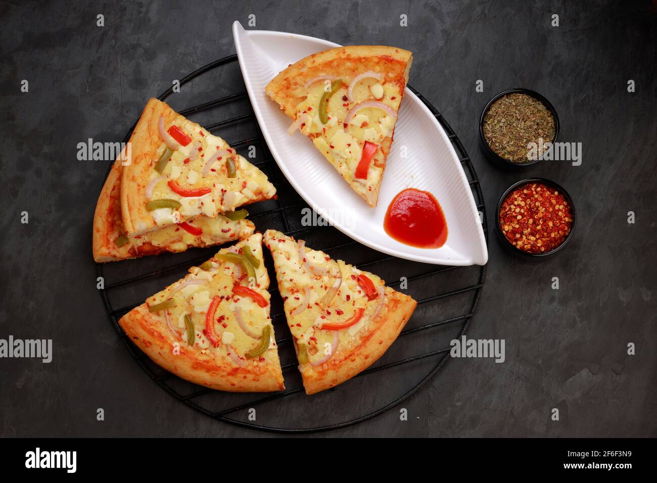 Pizza 3 layered cheese pizza, made using red ,green and yellow bell ...