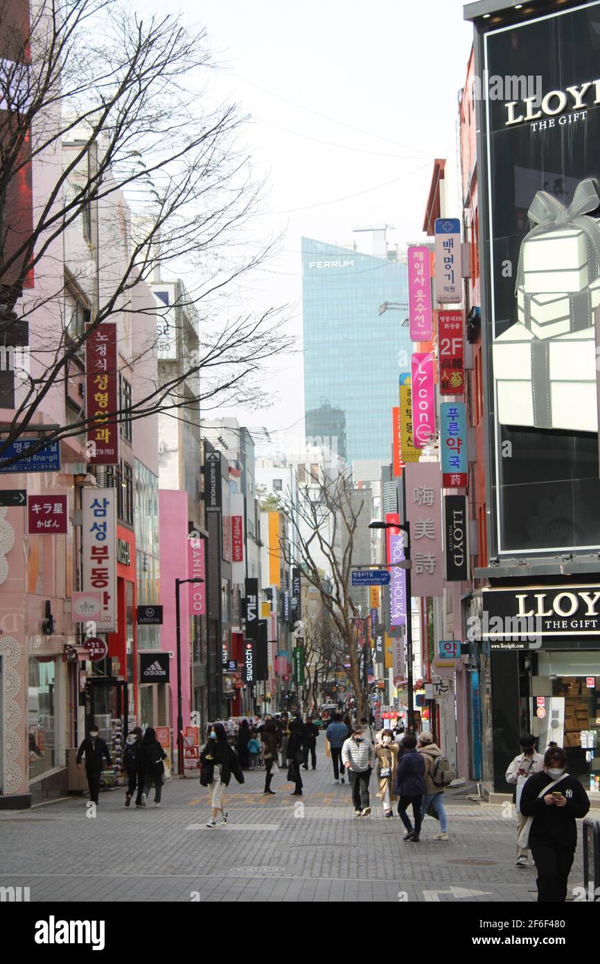 People walking down busy commercial avenue in Myeongdong, Seoul Stock ...