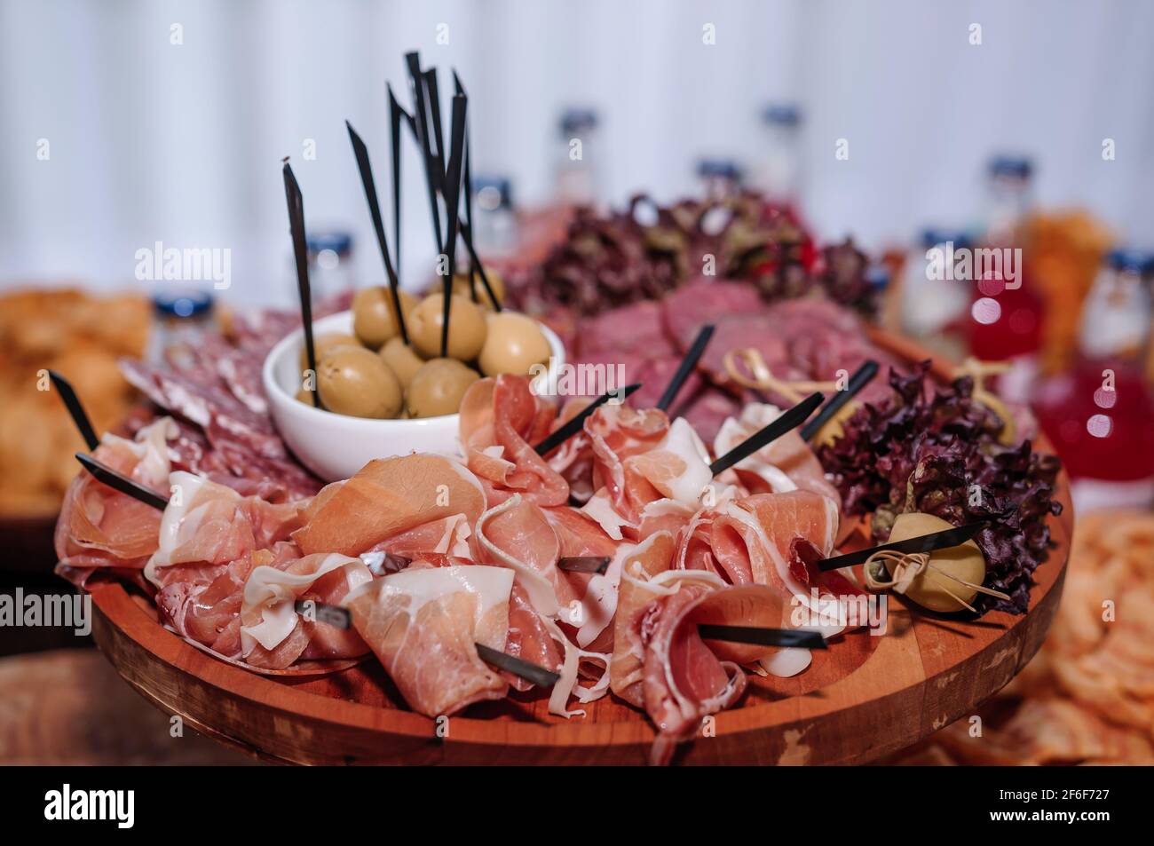 Slicing different types of meat. Wedding buffet Stock Photo - Alamy