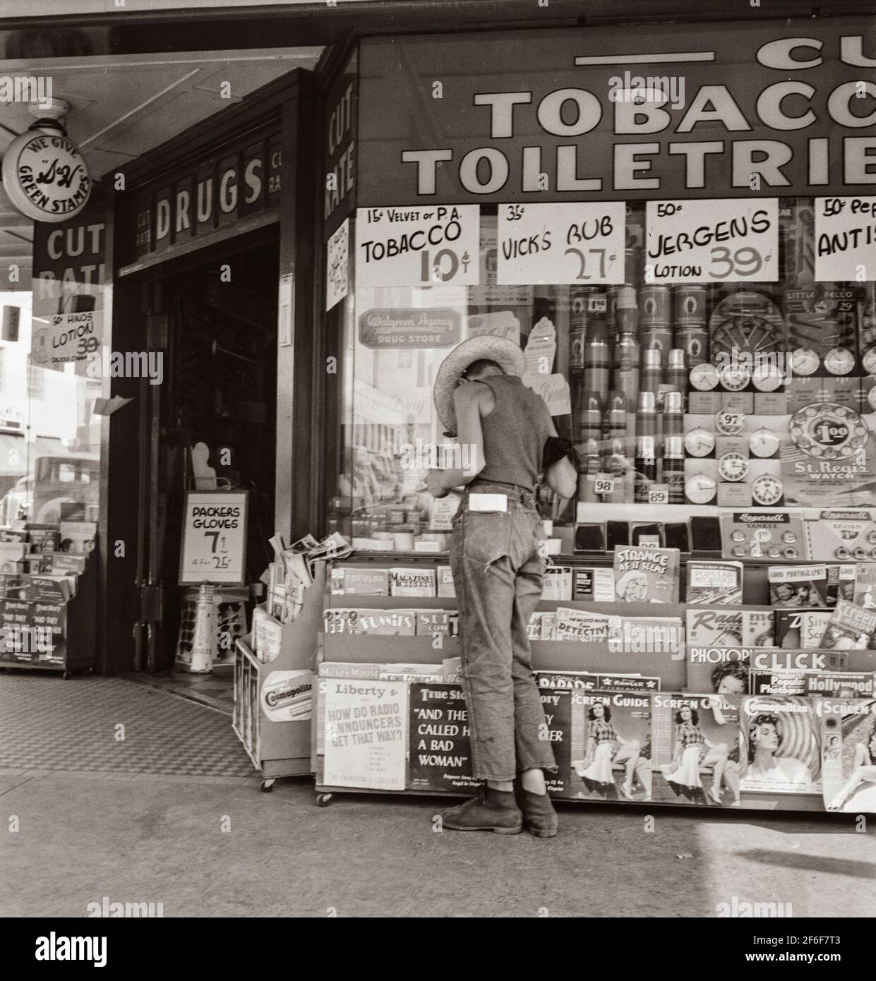 Oregon. Medford. Half-grown farm boy on main drugstore corner in town ...