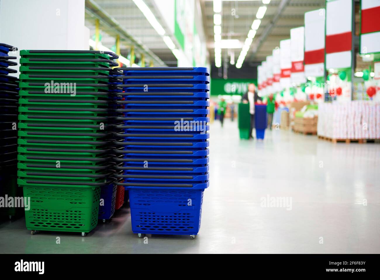 Stack of shopping baskets in a supermarket with copy space Stock Photo ...