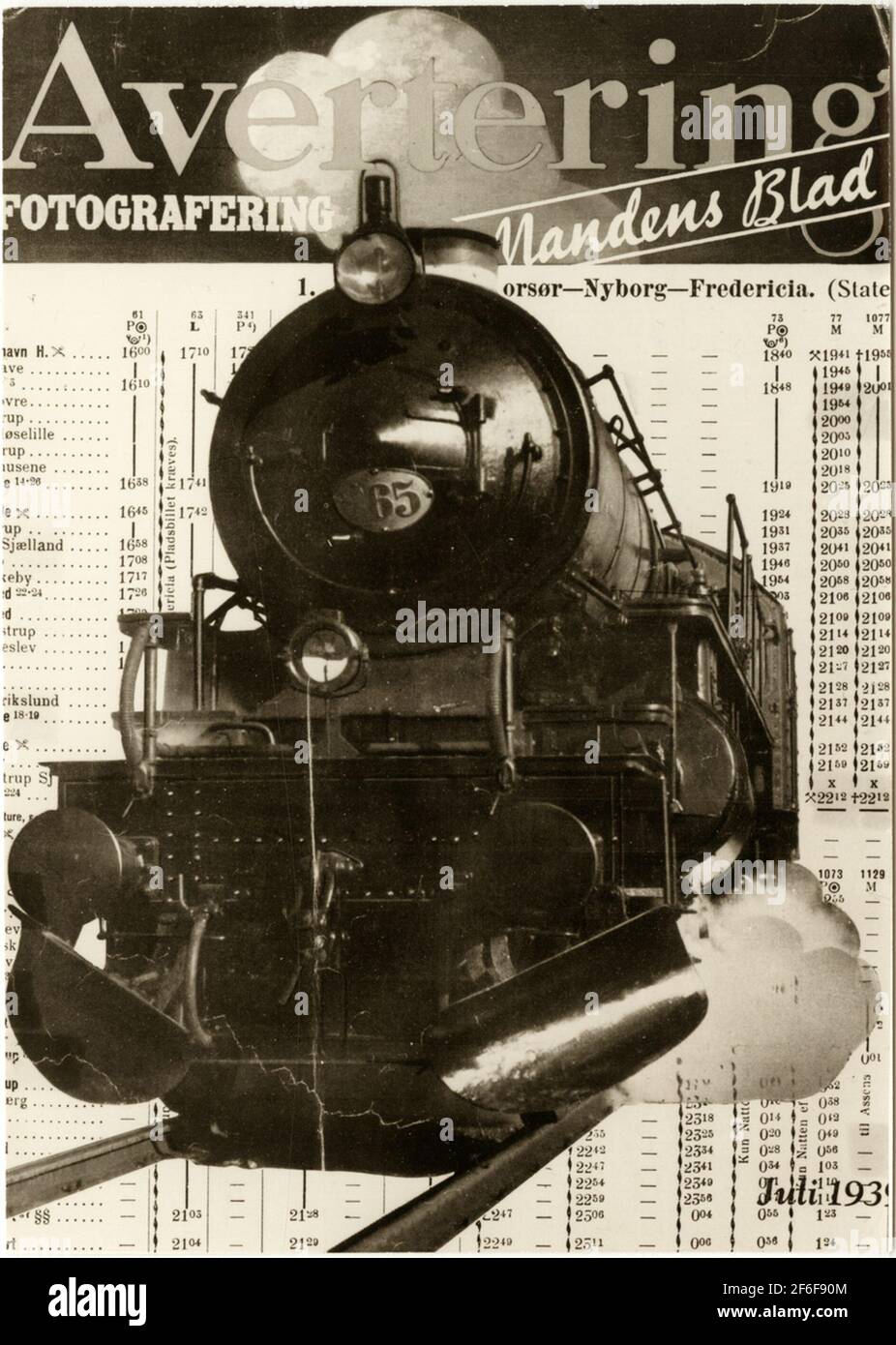 Photograph of front on newspaper with steam locomotive Stock Photo - Alamy