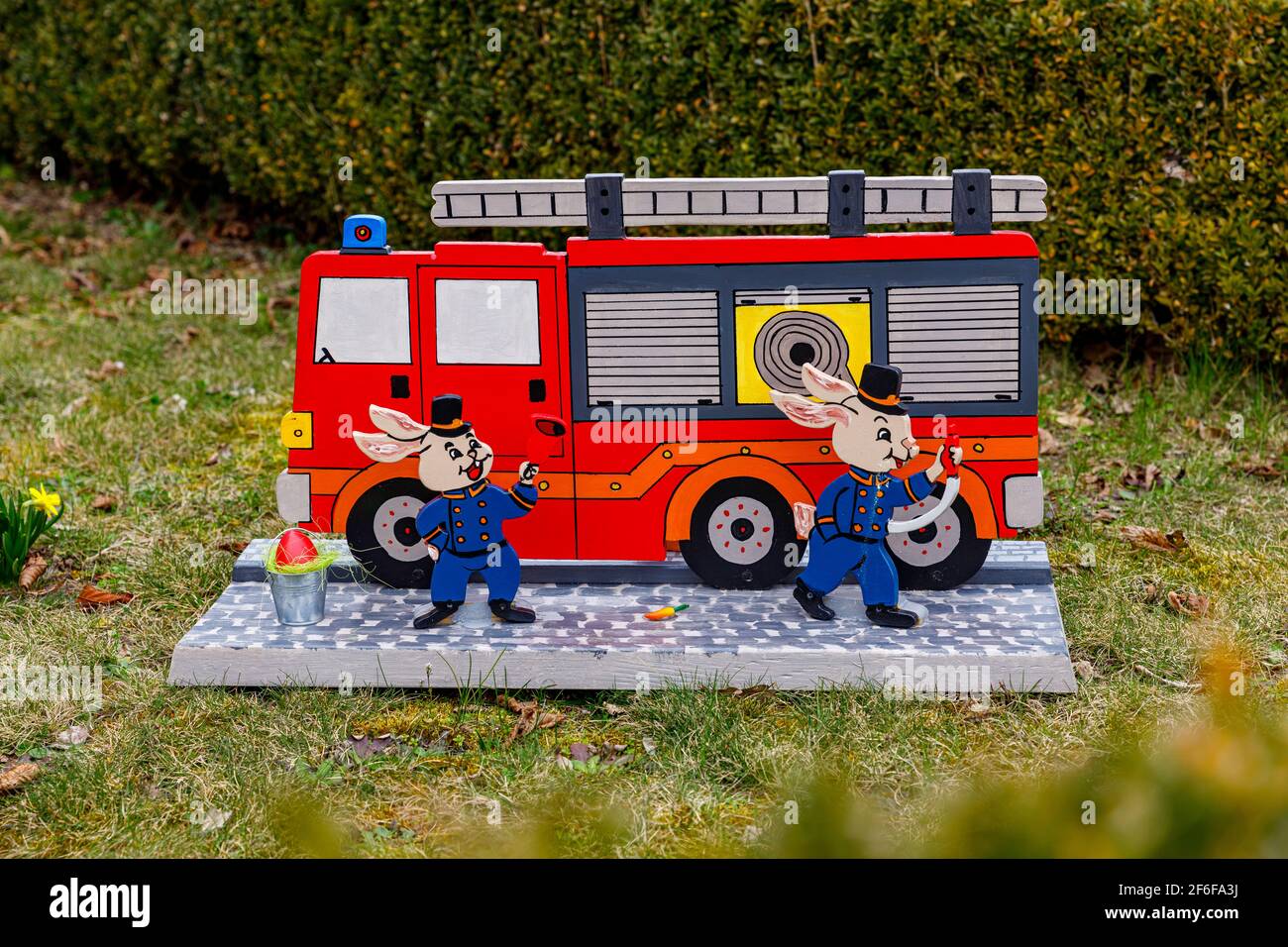 Easter Bunny with a fire engine at the Easter Bunny Trail of ...