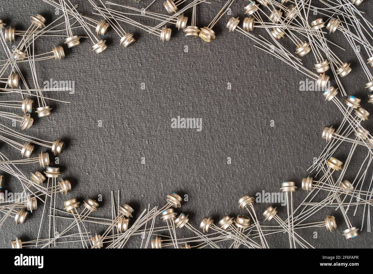 Old many soviet transistors in metal case on black background with copy ...