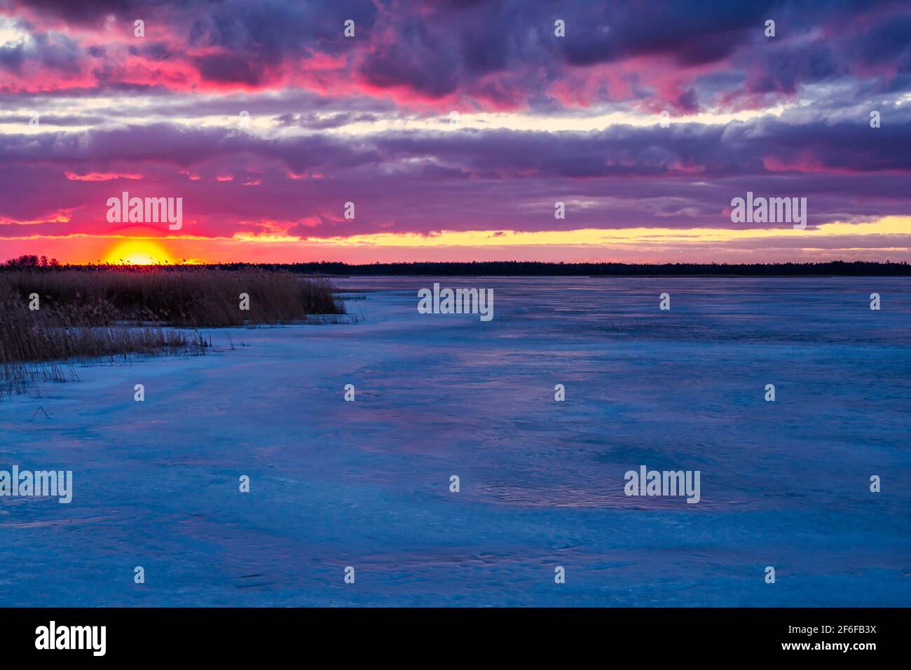 Frozen Water Lake with Sunset Skyline Background Stock Photo - Alamy