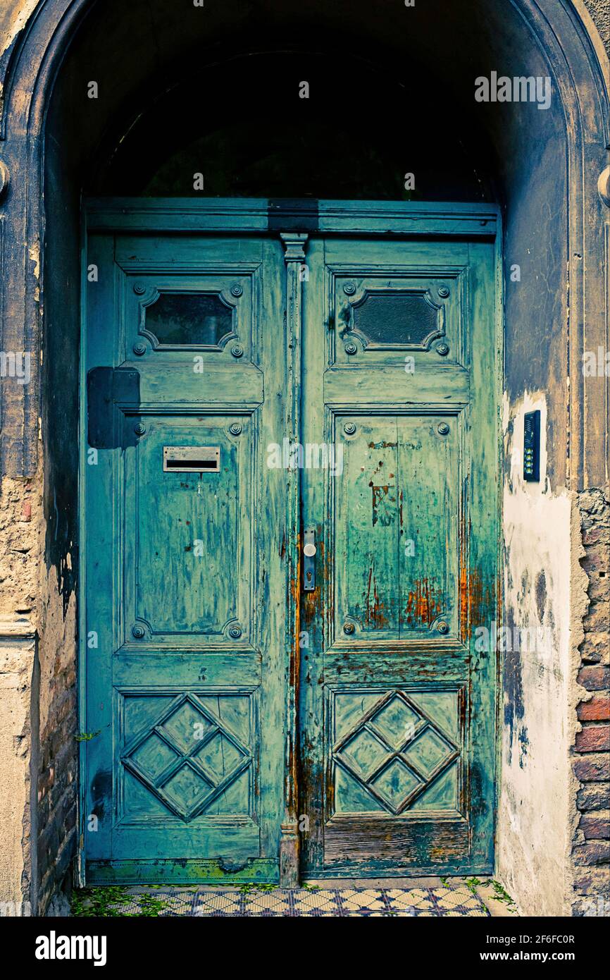 green old wooden door in decay Stock Photo - Alamy